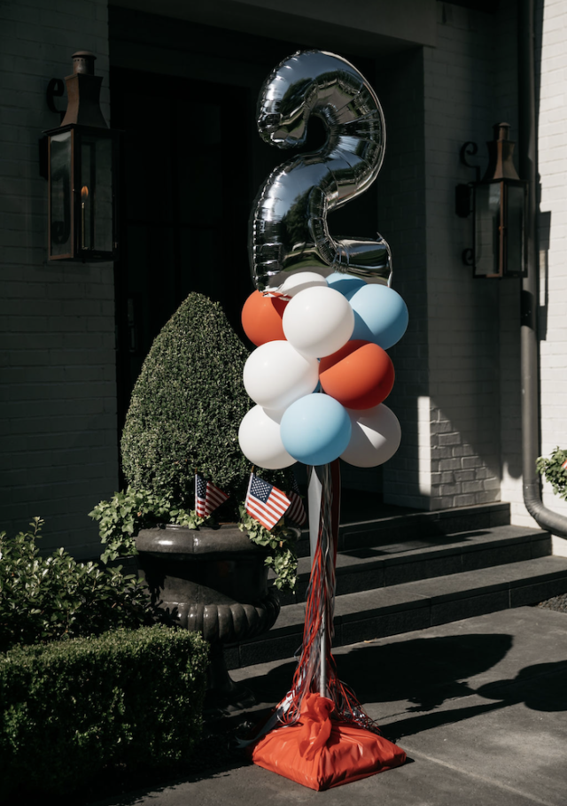 Red white and two 2nd birthday party - white bounce house